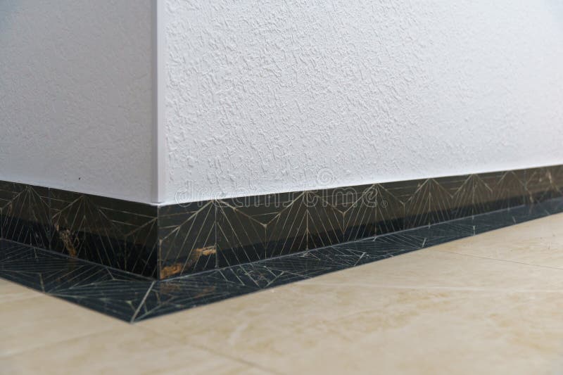 The Detail of the Corner Baseboard on the Wall and Granite Tiles on the ...