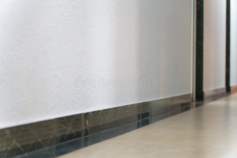 The Detail of the Corner Baseboard on the Wall and Granite Tiles on the ...
