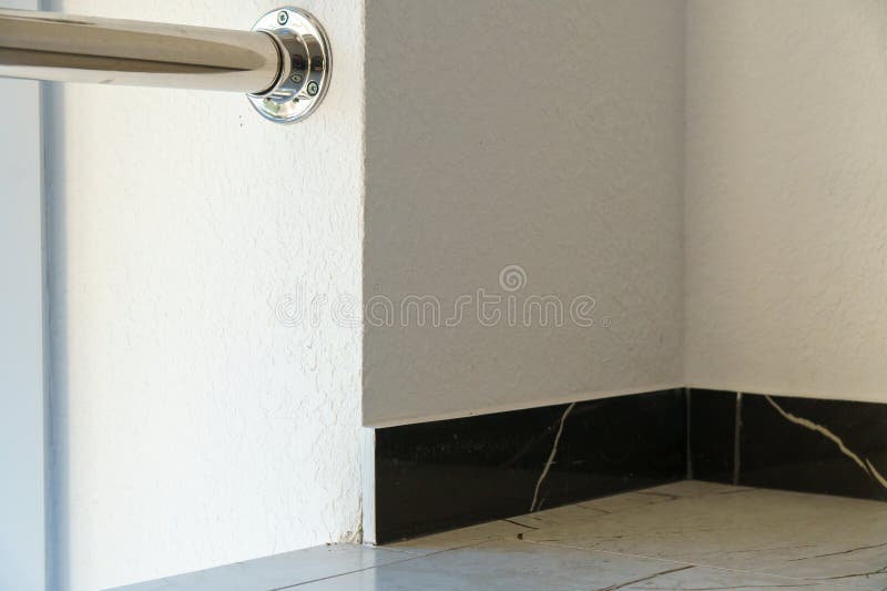 The Detail of the Corner Baseboard on the Wall and Granite Tiles on the ...