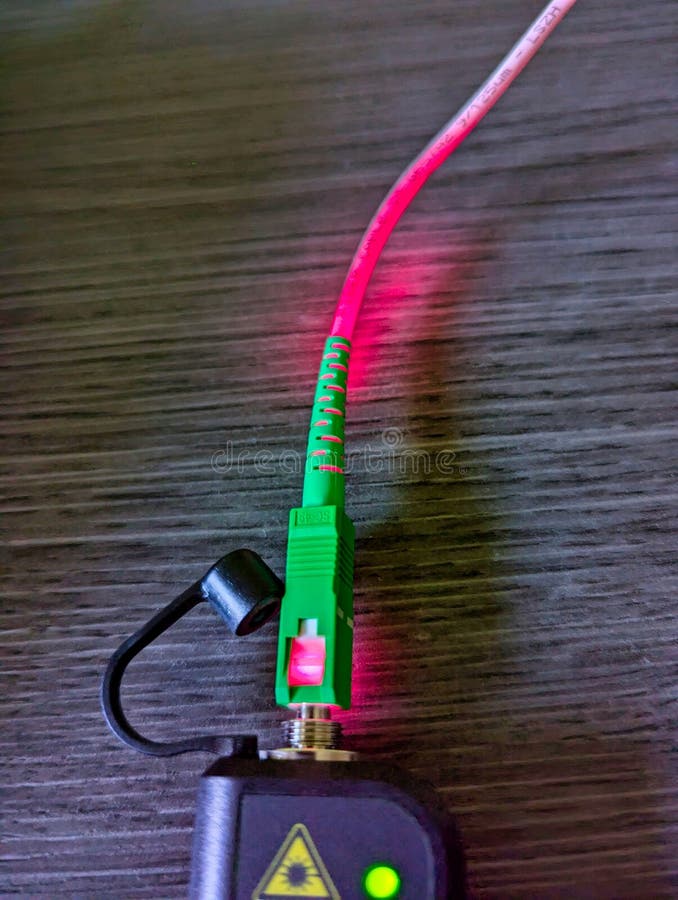 Detail of a Device Testing an Optical Fiber through Which Data Passes ...