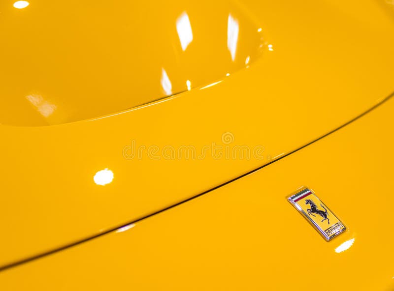 Detail of an Emblem of Ferrari on a Yellow Car Editorial Photography ...