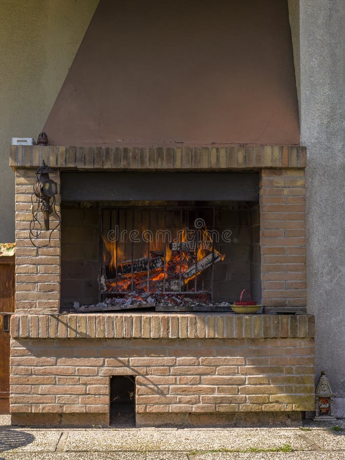 Close Up of a Fireplace with a Fire Burning Stock Photo - Image of ...