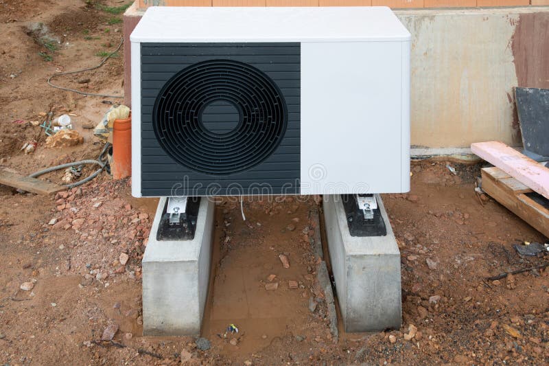 External Heat Pump Unit Against the Wall of the House. Modern ...