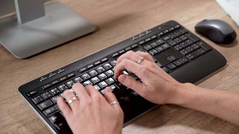 Detail on a Hand Controlling a Computer Using a Keyboard and a Mouse ...