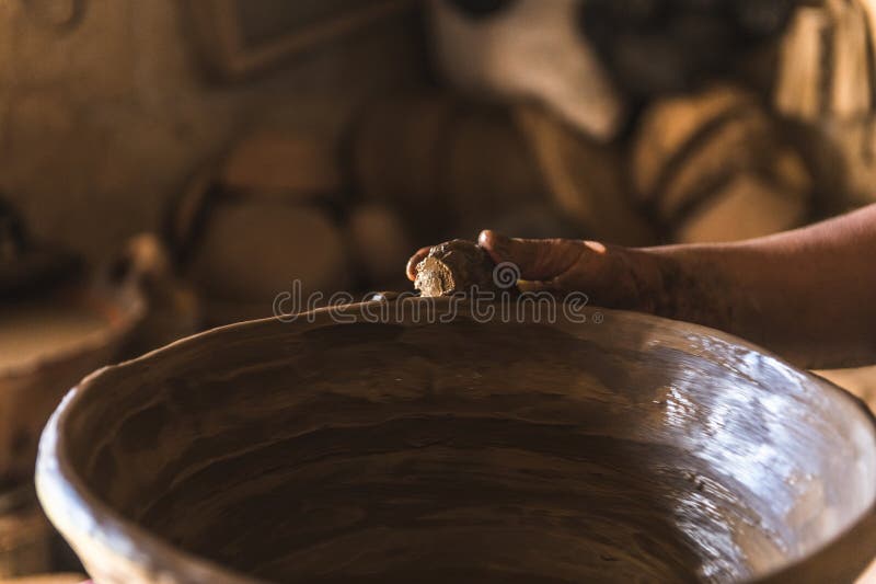 Detail of the Hands of an Artisan Making a Clay Pot with His Tools ...