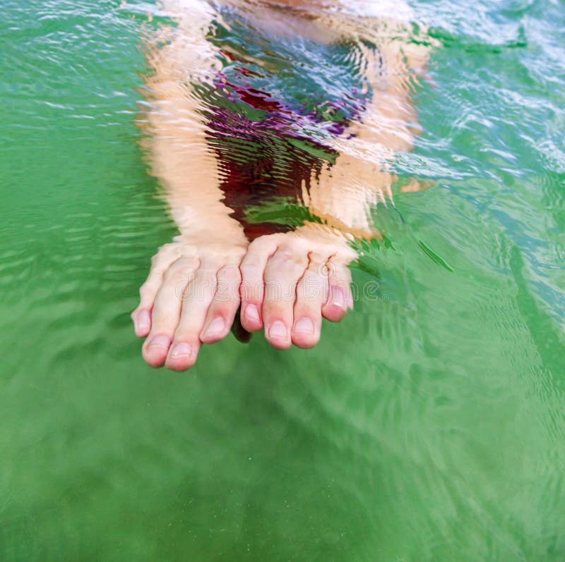 Detail of Hands Swimming in the Ocean Stock Photo - Image of surf ...