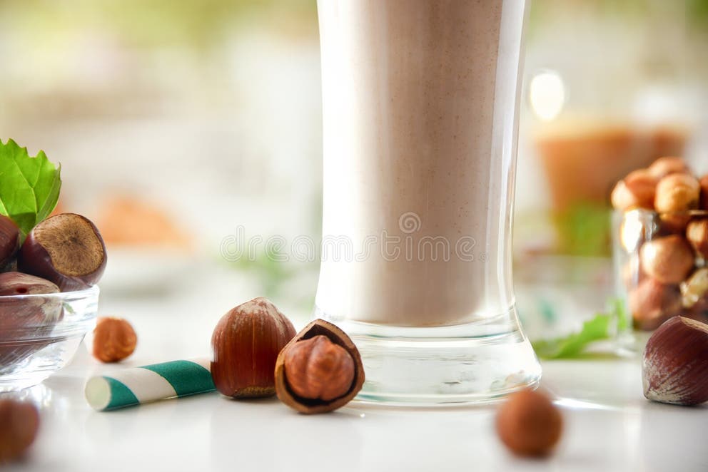 Detail of Hazelnut Smoothie with Glass and Nuts Around it Stock Photo ...