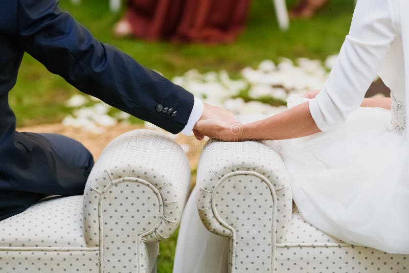 Detail of Joined Hands of a Happy Couple during Their Wedding Stock ...