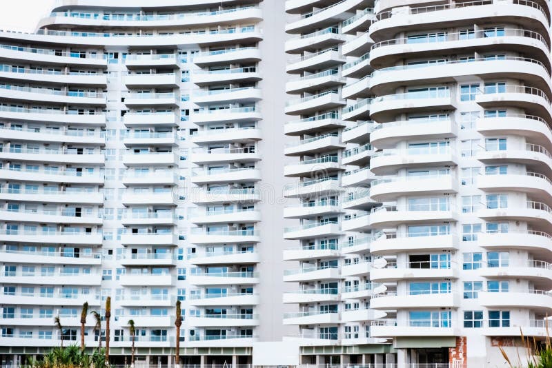 Detail of the Large Facade of a White Building with Terraces and ...