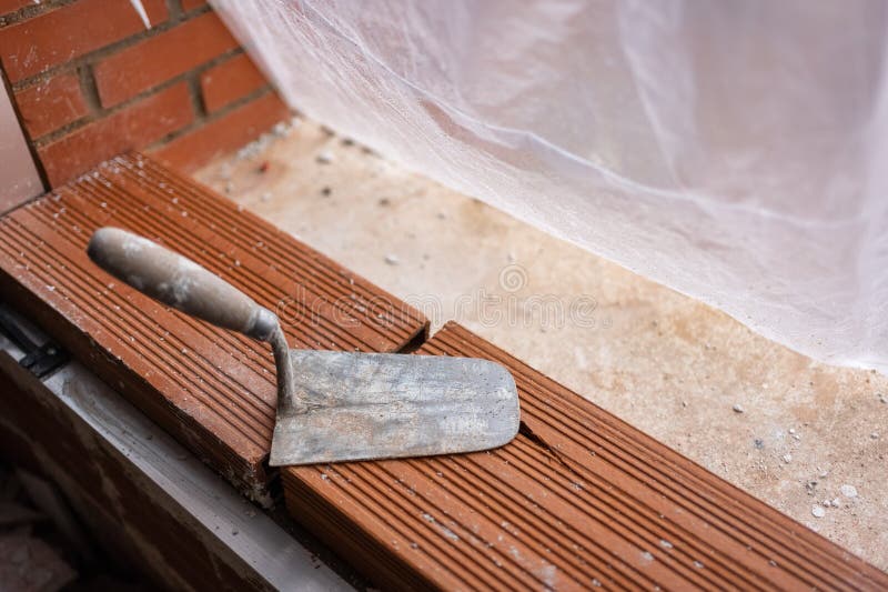 Detail of Masonry Tool for Laying Bricks on a Construction Site. Stock ...