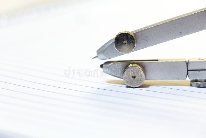 Detail of a Metal Drawing - Drafting Compass on a Paper Sheet. Stock ...