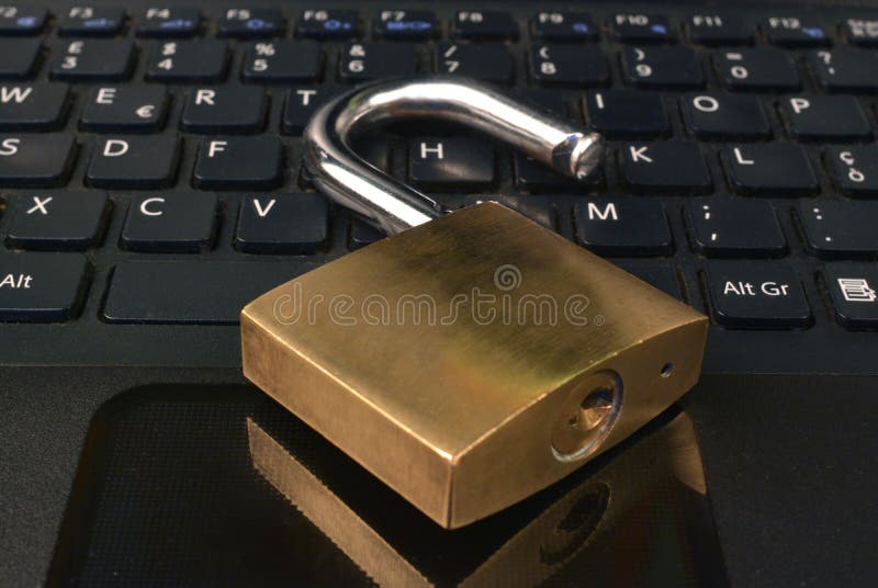 Detail of a Metallic Security Padlock Above a Computer Keyboard Stock ...