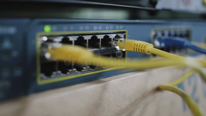 Detail of Network Cable Being Plugged into Networking Switchboard Stock ...