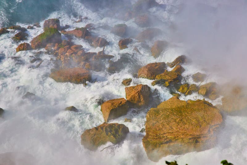 Detail of Niagara Falls Crashing into Rocks Below with Mist Stock Photo ...