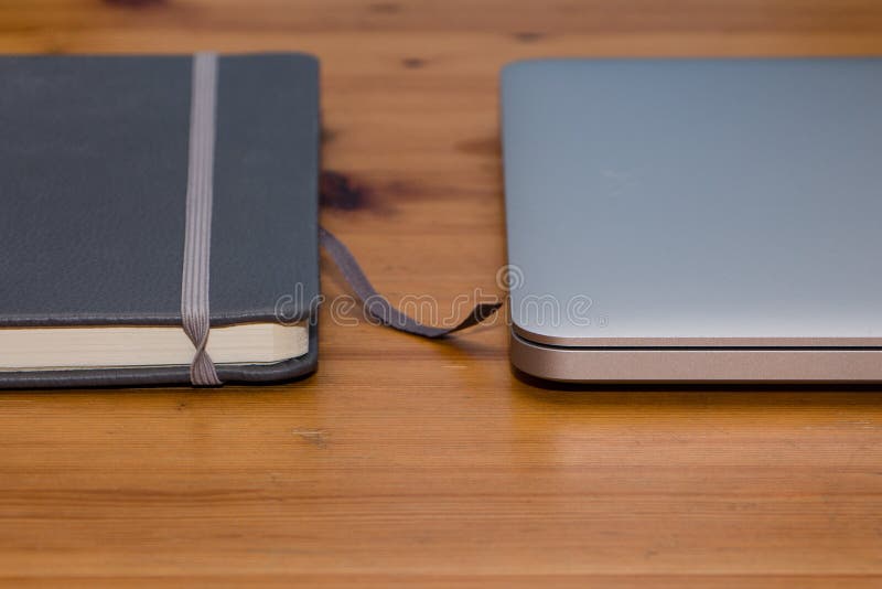 Detail of a Notebook and Laptop on Wooden Table Stock Photo - Image of ...