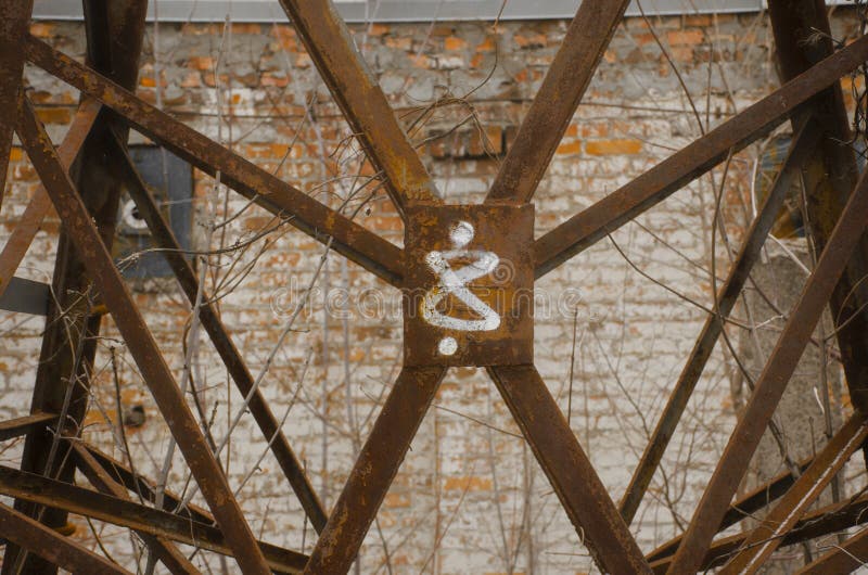 Detail of Old Rusty Metal Structure on Brick Wall Background. Number ...