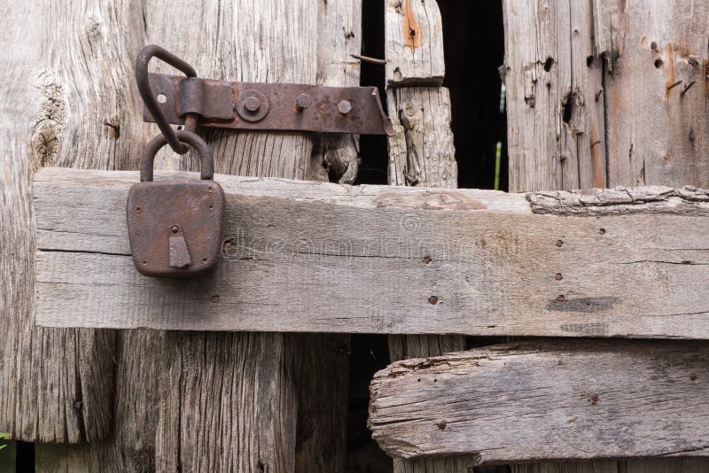 Detail, Old Rusty Padlock on Broken Wooden Barn Doors Stock Image ...