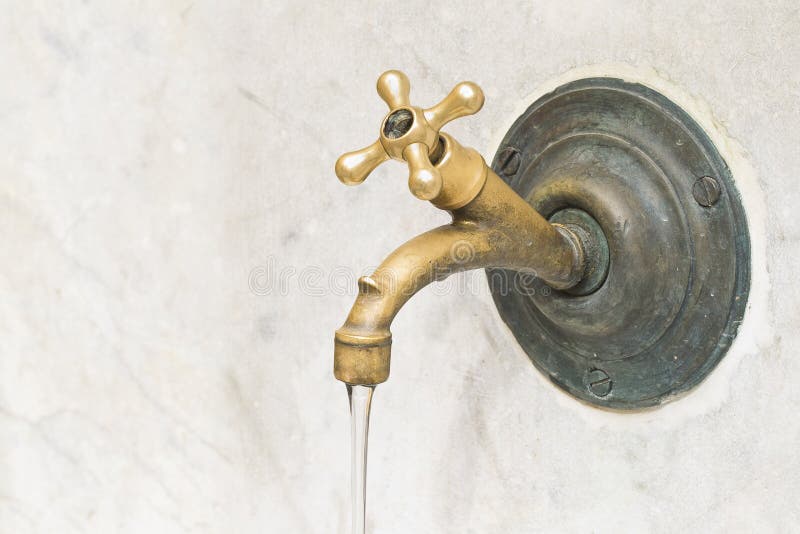 Detail of a Old Water Brass Faucet with Drinking Water Running Down ...