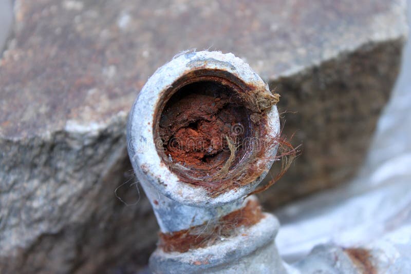 The Detail of the Old Water Pipe Ingrown with Rust. Stock Photo - Image ...