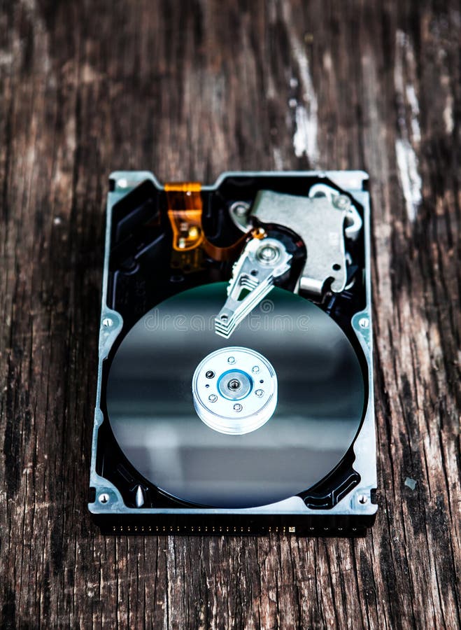 Old Opened Hard Disc on a Pile of Compact Discs Stock Photo - Image of ...