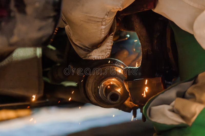 Detail-Oriented Mechanic Performing Precision Welding on Automotive ...