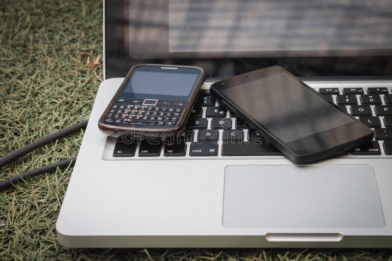 Detail of Phones on Computer Keyboard Editorial Stock Image - Image of ...