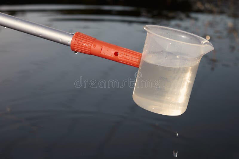 Detail of Plastic Sampling Beaker on Rod with Sample of Water Stock ...