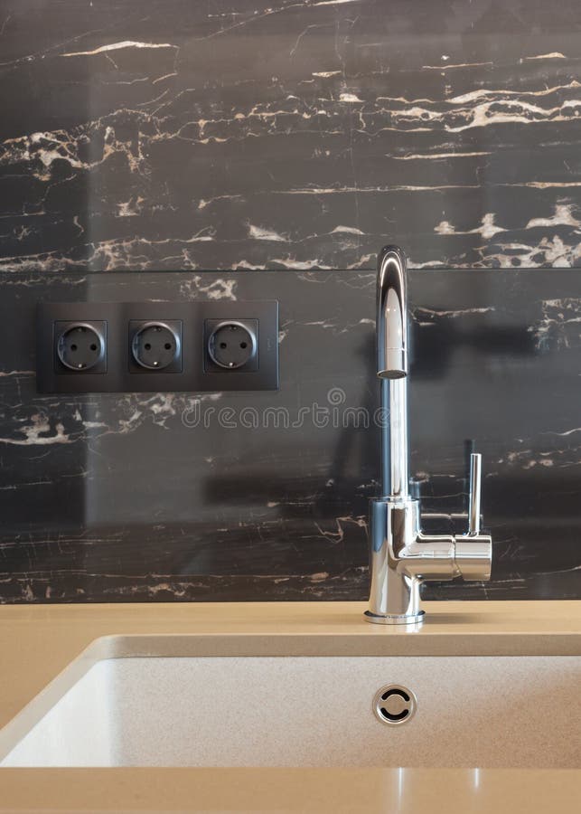 Detail of a Rectangular Designer Kitchen Sink with Chrome Water Tap ...