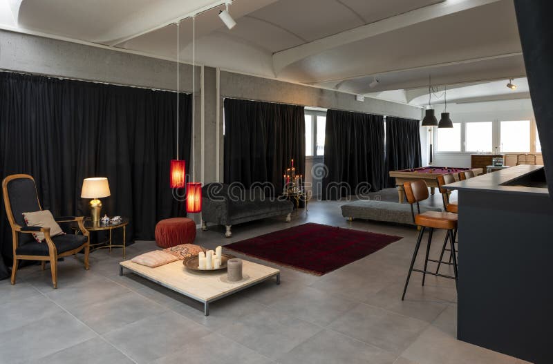 Detail of the Room with a Pool Table, a Sitting Area with Armchairs and ...