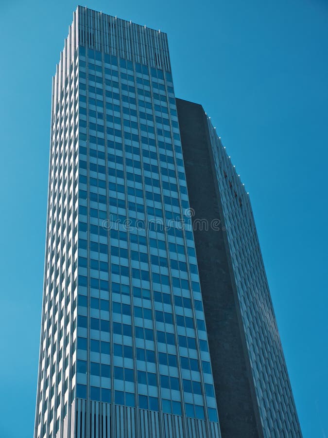 A Detail Shot of a Skyscraper on a Clear Sky with a Building Next To it ...