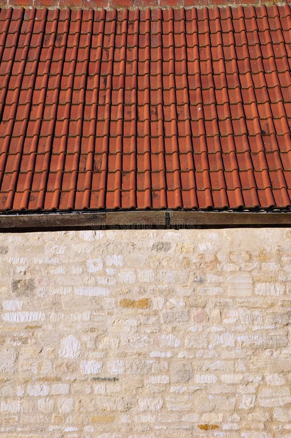 Detail of a Stone Wall and Roof Tiles Stock Photo - Image of industry ...