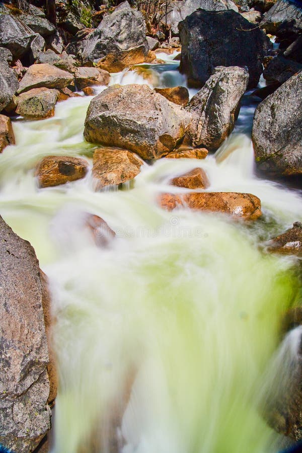 Detail of Teal Water Pouring through River Over Rocks Stock Image ...