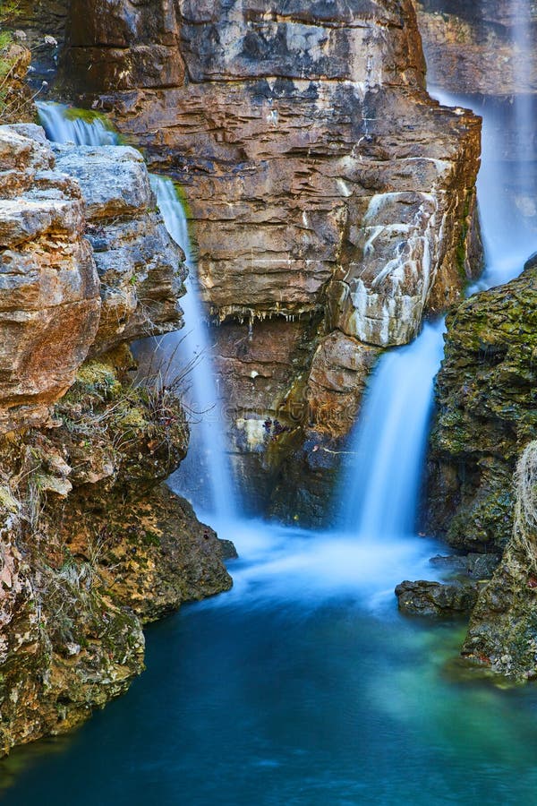 Detail of Two Waterfalls Pouring into a River through Rocky Cliffs ...