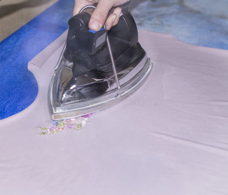 Detail Under the Steam Iron in the Garment Industry Stock Photo - Image ...