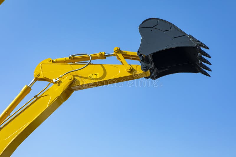 Diggers on the blue sky stock image. Image of machinery - 182347173