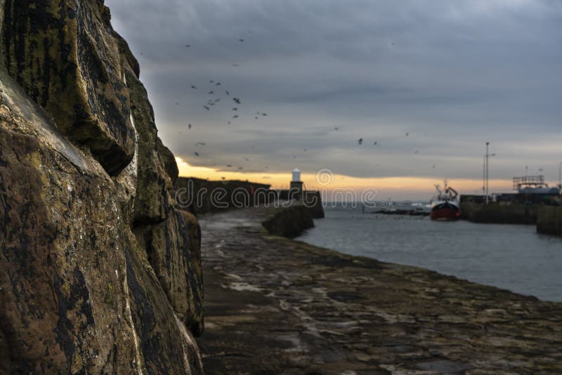 Detail of the Wall with an Harbor on a Background Stock Image - Image ...
