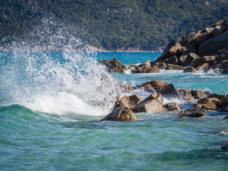 A Wave Breaking on the Rocks. Stock Photo - Image of coast, blue: 111271592