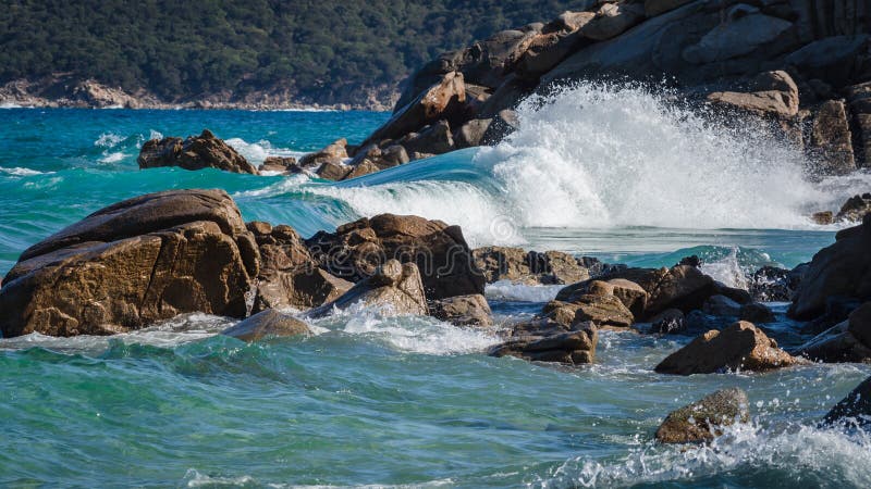 A Wave Breaking on the Rocks. Stock Photo - Image of wave, splash ...