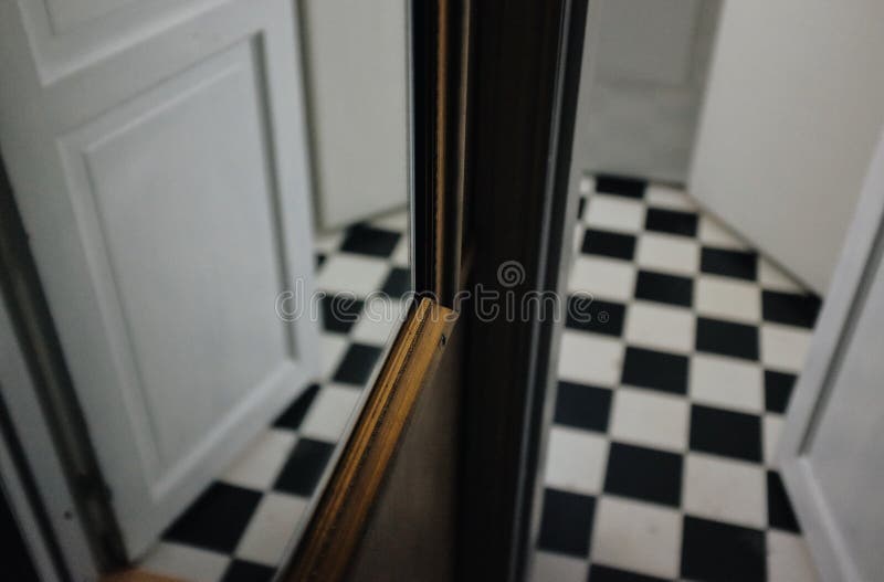 Detail of a White Door and Checkered Floor Stock Photo - Image of ...