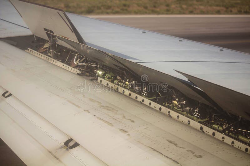 Detail of the Wing of an Airplane with Flaps in Motion Stock Photo ...