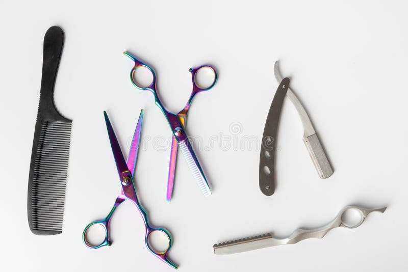 A Detailed Aerial View of Barber Tools on a White Backdrop. Scissors ...