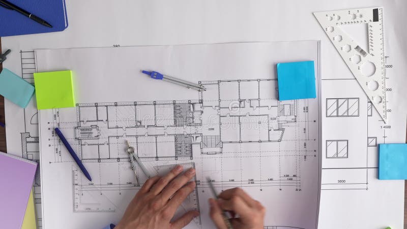 Architectural Blueprint with Hands and Drawing Tools on Table Stock ...
