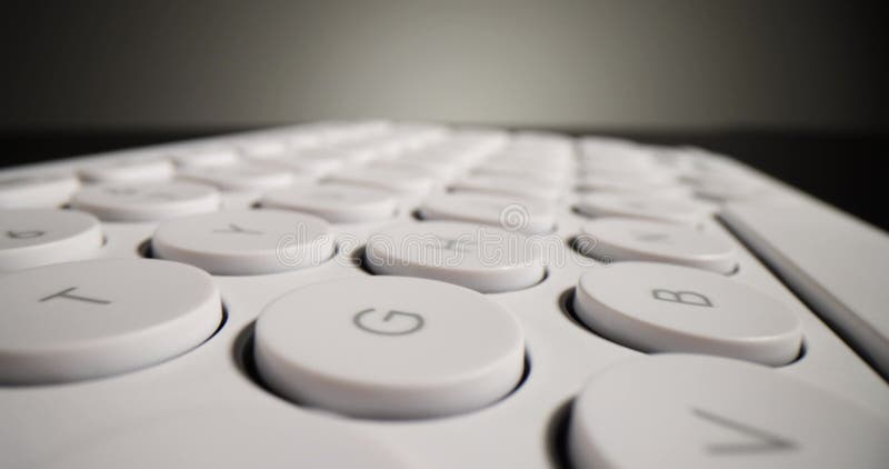 Detailed Buttons of White Computer Keyboard Lying on Table Stock Video ...