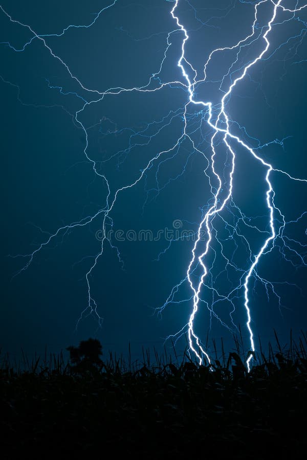 Thunderbolt of Lightning Strikes Earth Stock Photo - Image of charge ...