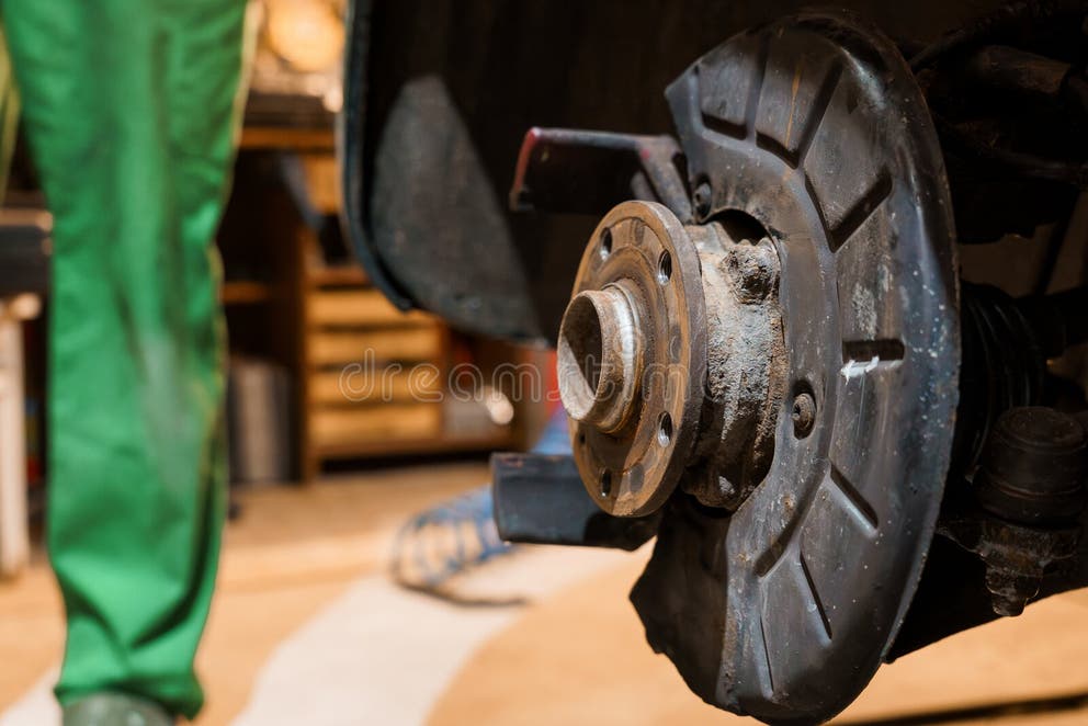 Detailed Close-Up of a Car Brake System in a Workshop Setting Stock ...