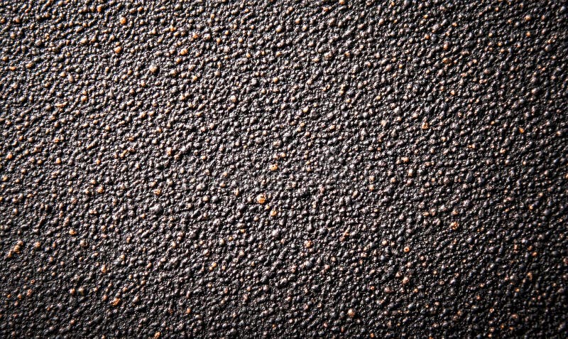 Detailed Close-up of a Dark, Rough Texture with Subtle Brown Speckled ...