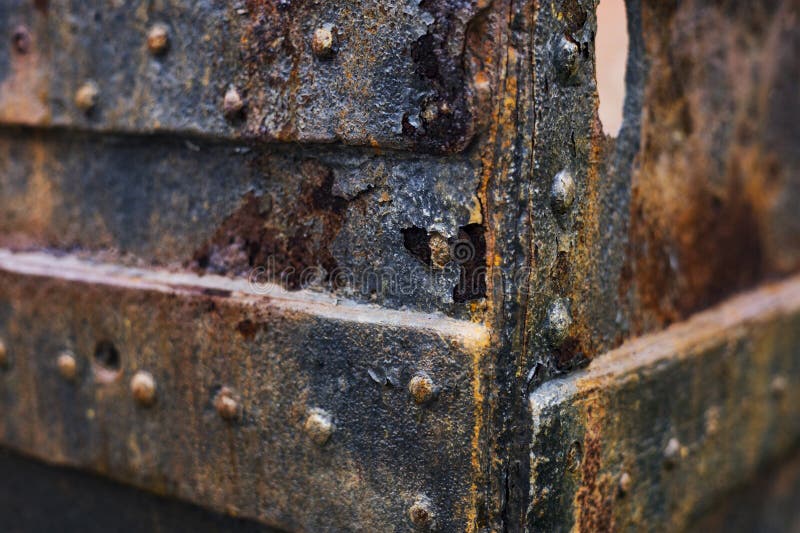 A Detailed Close Up Image of a Rusty Metal Object Featuring a Hole in ...