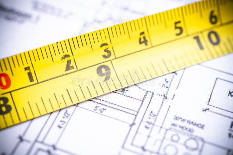 Detailed Close-Up of a Measuring Tape on Architectural Blueprints for ...