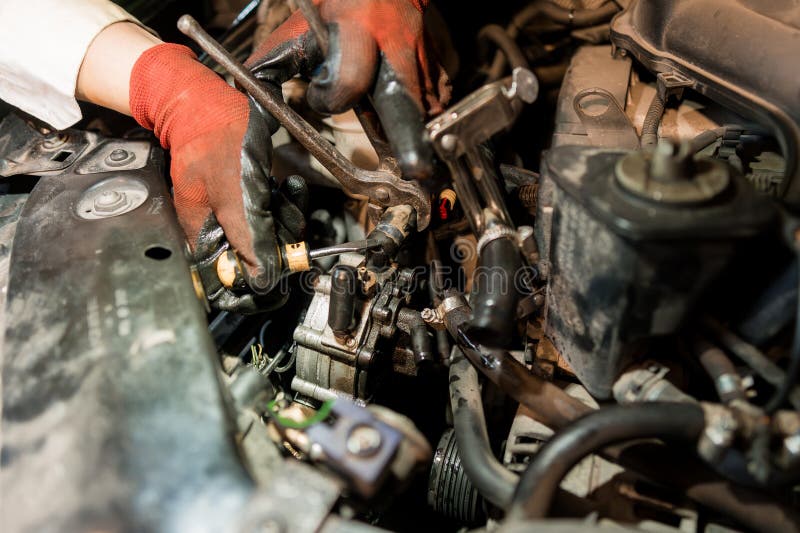 Detailed Close-Up of a Mechanic Working on an Engine Component Stock ...