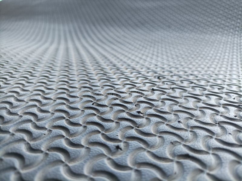 Close-up of a Textured Rubber Mat with a Wave-like Pattern, Creating a ...